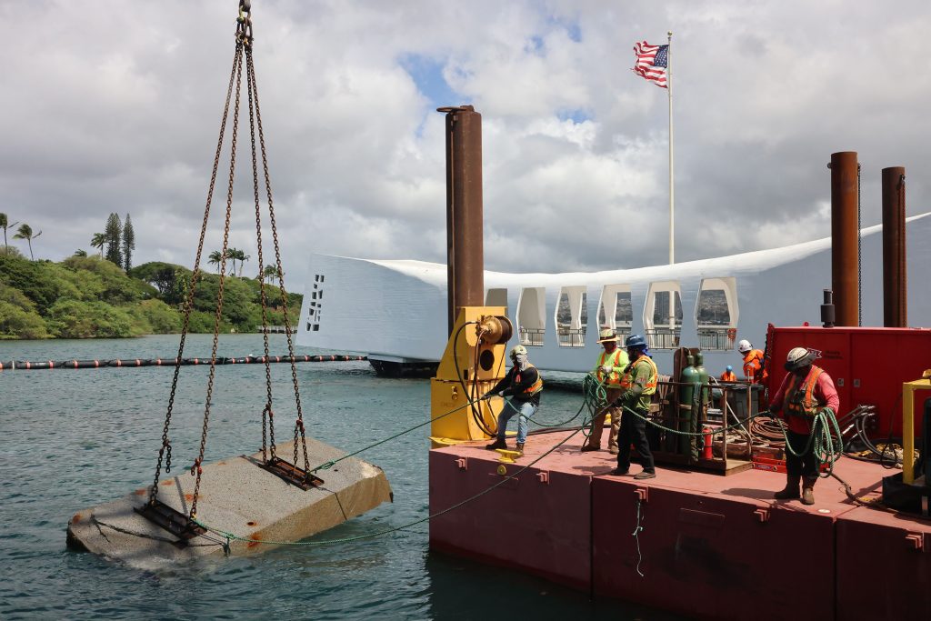 Navy divers remove significant portions of WWII platforms from USS ...